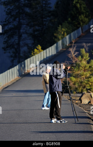 Wildlife photographer, on the Centennial Trail walking path, near Lake ...