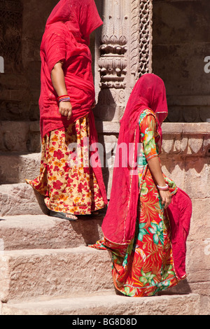 A Rajasthani woman wearing a traditional veil called a Ghoonghat ...