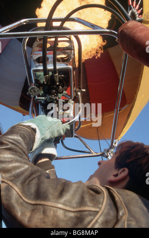 Hot air ballooning pilot of a single one man balloon with no basket ...