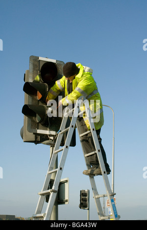 Man Fixing Traffic Lights Stock Photo - Alamy