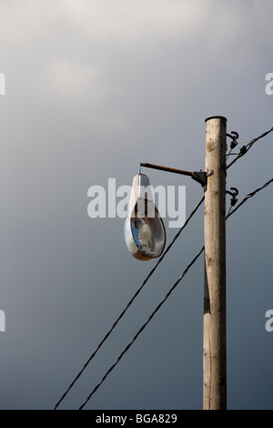 Broken street lamp in a wooden pole Stock Photo - Alamy