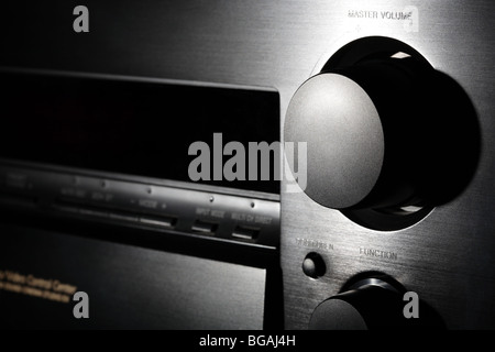 Volume control knob of a black amplifier with dial numbers. Close up ...
