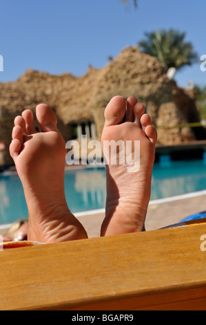 close-up close up of woman's foot soles B&W on black leather Stock ...