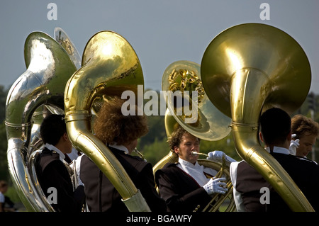 Tuba players from a marching band warming up before a football game ...