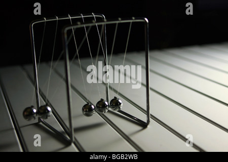 five metal balls hanging from nylon string Stock Photo: 27287751 - Alamy
