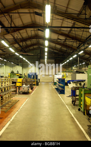 Closed down empty factory interior manufacturing hall with tall ceiling ...