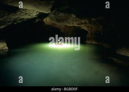 Exploring a water logged cave Stock Photo - Alamy