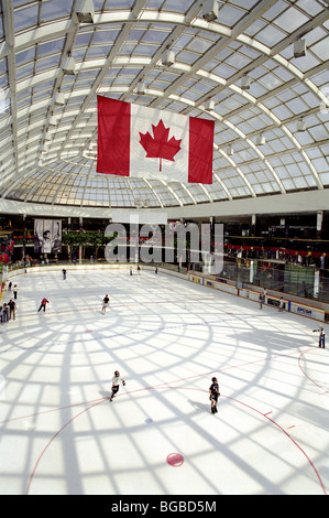 Canadians ice skating on a rink in front of the city hall building at ...