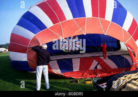 Crew members inspecting the interior of a hot air balloon Stock Photo ...