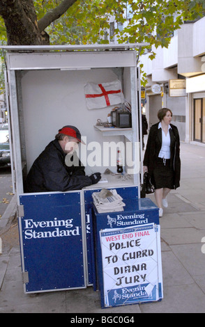 London newspaper vendor distributing free newspapers on High Holborn ...