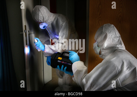 Crime scene investigation, forensic people at a murder scene. Police work, preservation of ...