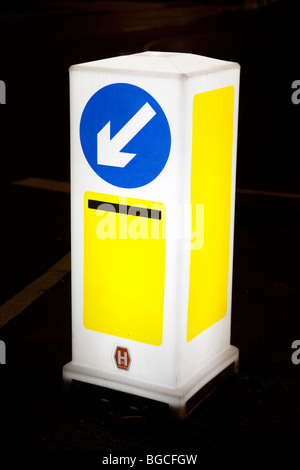 illuminated keep left sign Stock Photo - Alamy