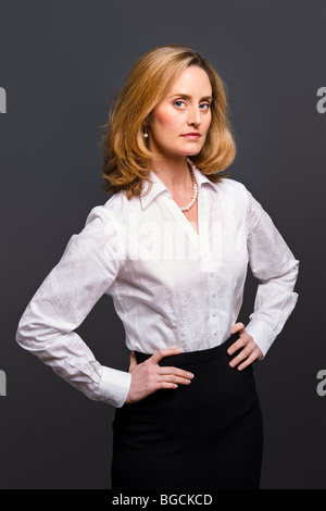 Portrait of a woman wearing a white shirt and elegant shawl outdoors ...