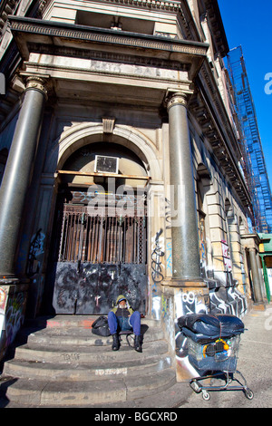 Homeless man in front of 190 Bowery Germania Bank Building, Lower East ...
