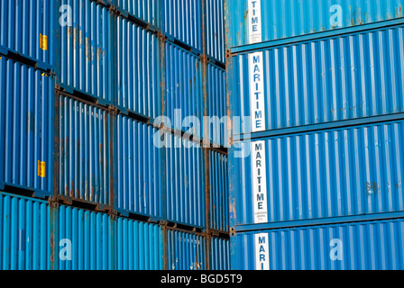 Bright blue shipping containers stacked up Stock Photo - Alamy