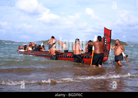 Maori warriors of a Waka Taua (war canoe) prepare their Waka on Te Ti ...