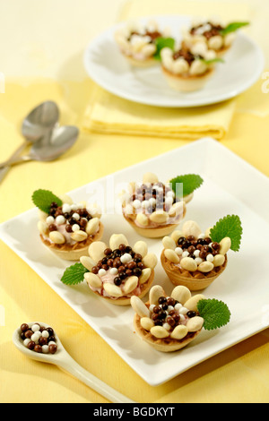 Closeup shot of small ball pastries with coconut flakes Stock Photo - Alamy