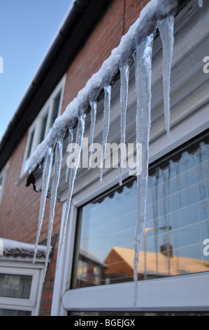Icicles on window Stock Photo - Alamy