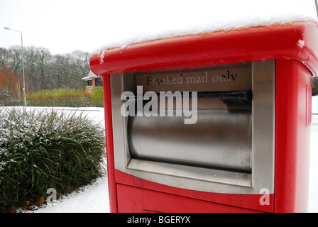Franked mail only red post box Stock Photo - Alamy