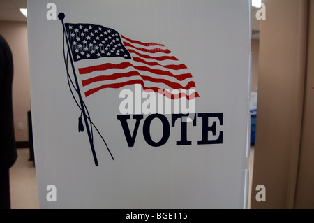 Voters mark their ballots at a privacy booth on first day of early ...