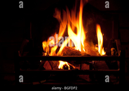 Real log fire with flames Stock Photo - Alamy