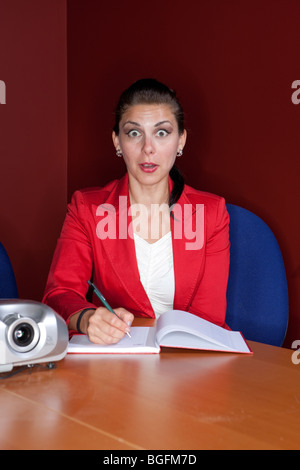 Receptionist taking a note Stock Photo - Alamy
