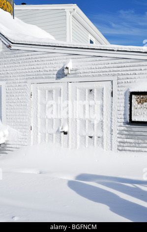 Doors of building covered in snow Stock Photo - Alamy