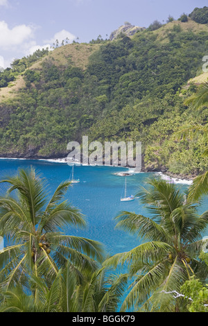 French Polynesia, Tahuata Island: boat in the Bay of Hapatoni under a ...