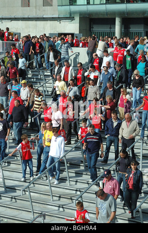 Crowds fans walking down the steps of Arsenal Football Club Emirates ...
