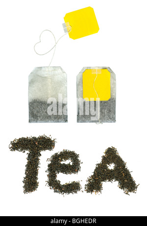 the word tea from leaves of green tea with jasmine on a wooden surface ...