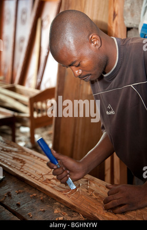 Woodcarving - wood carver Stock Photo - Alamy