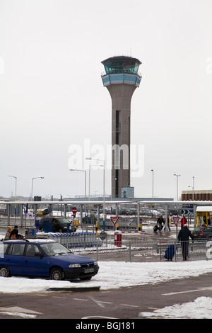 Luton Airport with air traffic control tower and planes at the gates ...