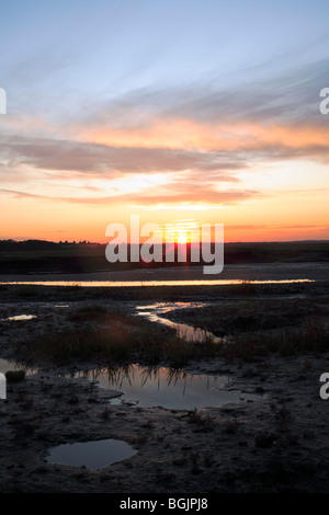 Sunset rays over the tidal marshes of Morston Quay, Norfolk, UK Stock ...