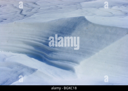 Snow drift patterns on background of blue sky Stock Photo - Alamy