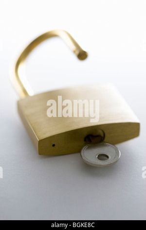 open padlock with key Stock Photo - Alamy
