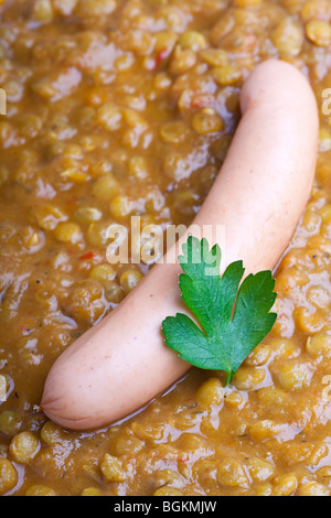 single wiener on a bed on beans Stock Photo - Alamy