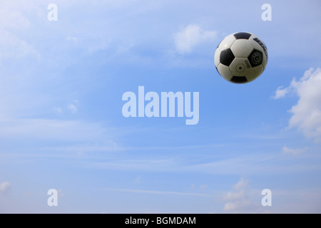 Soccer ball in mid air Stock Photo - Alamy