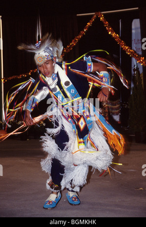 Young Cherokee man dressed in traditional buckskin leggings and ...