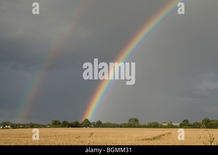 Rainbow with Secondary Over English Countryside Stock Photo - Alamy