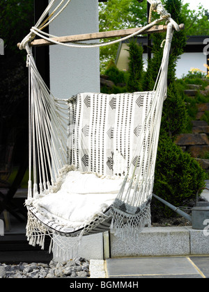 Hammock swing hanging in garden on a beautiful Spring day Stock Photo ...