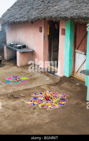 Rangoli designs outside a rural indian village house during the ...
