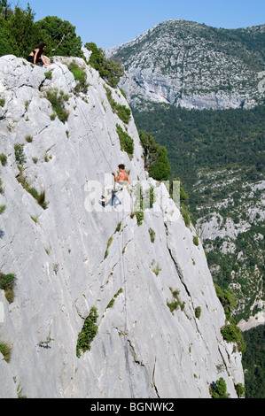 Rock climbers climbing the steep limestone cliffs in the canyon Gorges ...