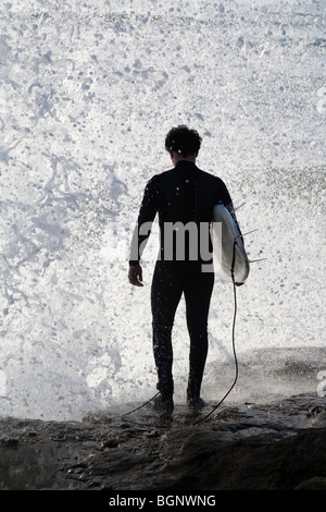 Vacation Silhouette Of A Surfer Carrying His Surf Board Home At Sunset ...