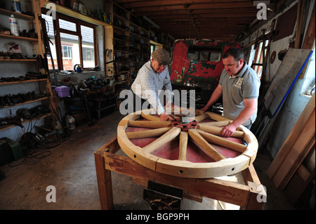 Two wheelwrights at Mike Rowland Wheelwright and coachbuilders, in ...