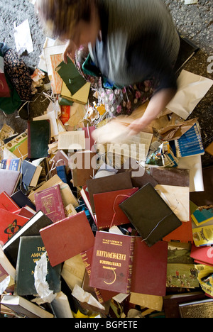 Manual sorting of different types of waste paper before the recycling ...