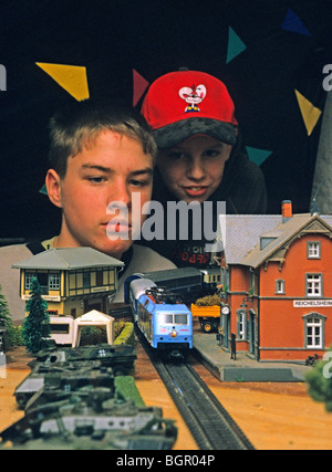 Two brothers are play train toy. Family with children at home. Love ...