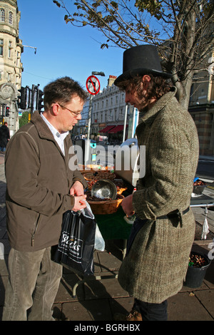 Chestnut seller wearing period costume in central Brighton Stock Photo ...