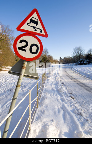 Warning signs, 20 m.p.h. and slippery road informing motorist of the ...