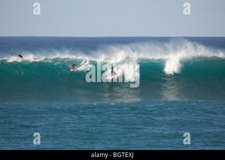 Two surfers collide on a large wave at Waimea Bay, Oahu, Hawaii Stock ...