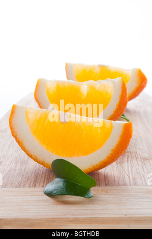 Orange slice with leaf isolated on a white background Stock Photo - Alamy